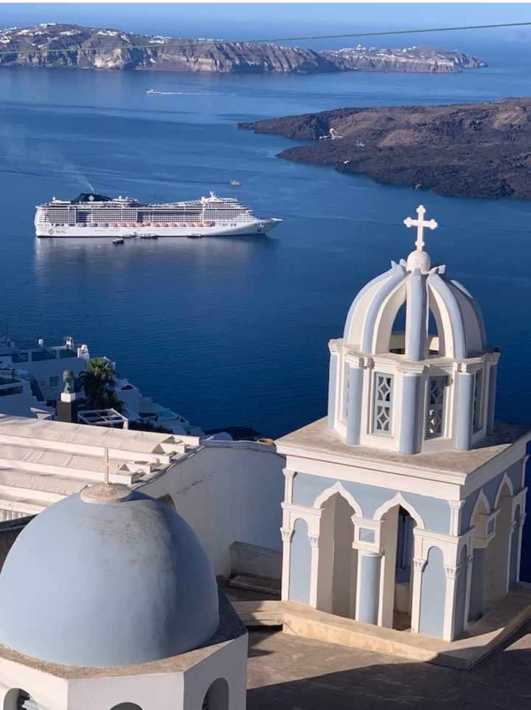 Firostefani's Harmonious Charm: The Three Bells Church ...